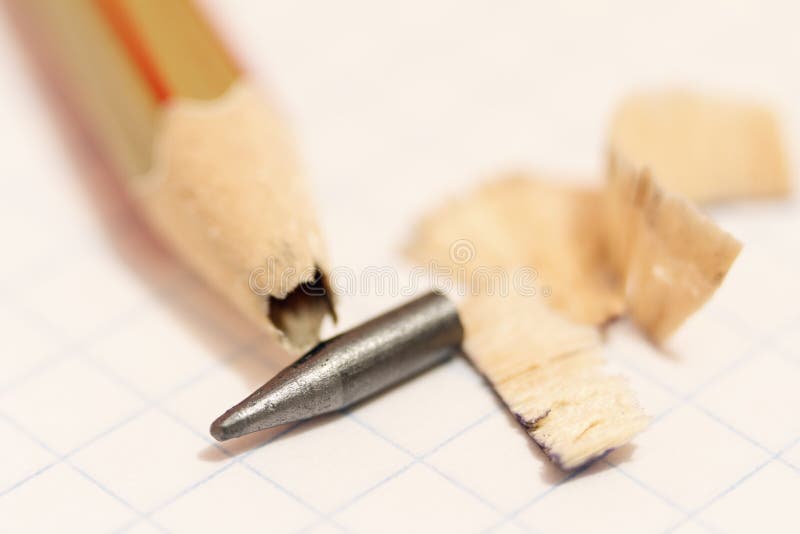 Sharpened Pencil with a Broken Tip Over a Blank Sheet of Paper Stock ...