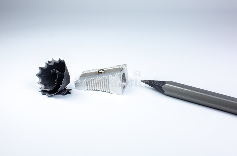Sharpener and a Broken Pencil. Shavings and a Graphite on White ...