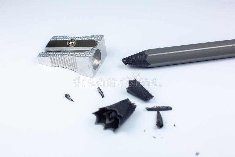 Sharpener and a Broken Pencil. Shavings and a Graphite on White ...