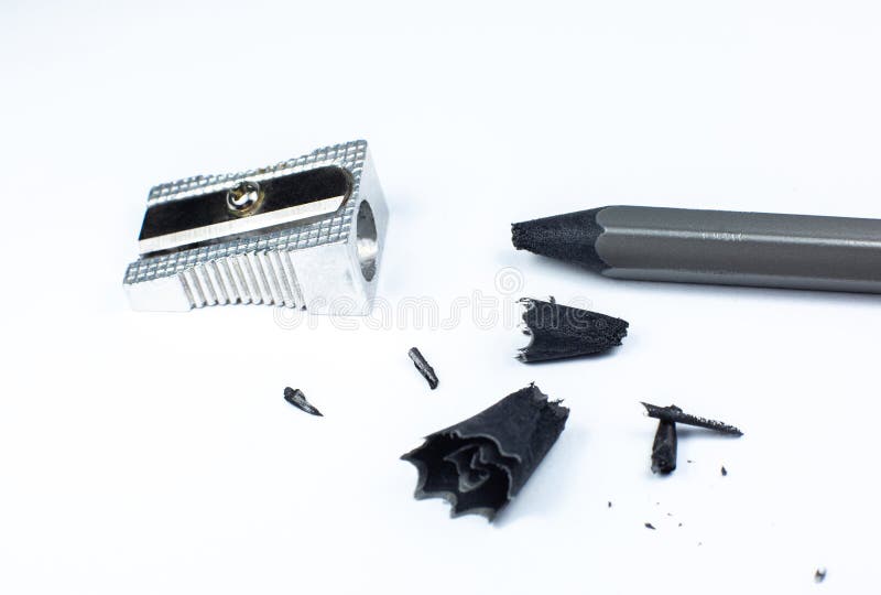 Sharpener and a Broken Pencil. Shavings and a Graphite on White ...