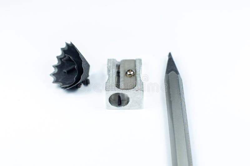 Sharpener and a Broken Pencil. Shavings and a Graphite on White ...