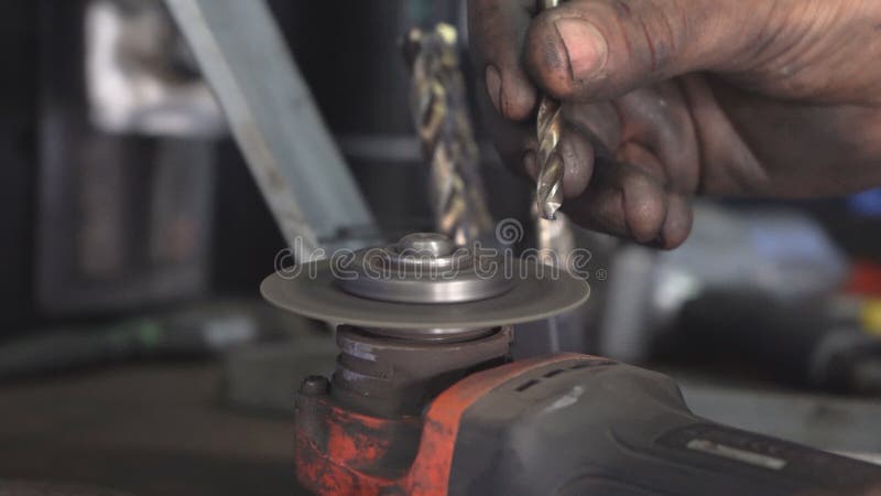 A Master Sharpens a Drill Using an Emery Disc Stock Footage - Video of ...