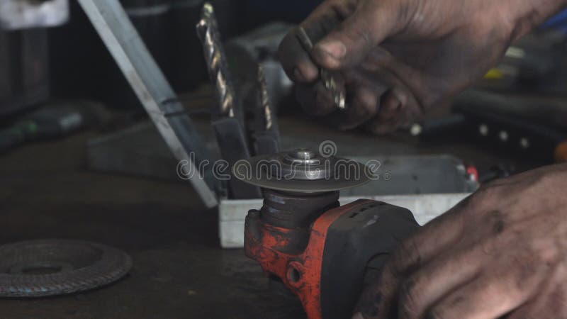 A Master Sharpens a Drill Using an Emery Disc Stock Footage - Video of ...
