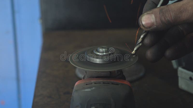 A Master Sharpens a Drill Using an Emery Disc Stock Video - Video of ...