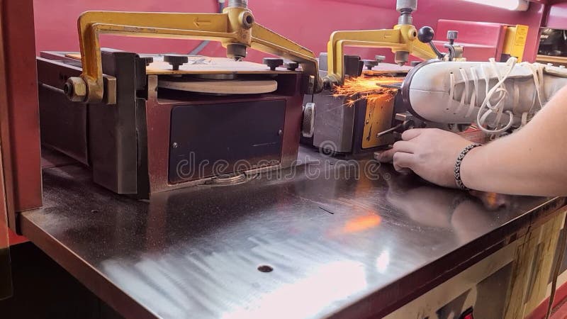 Sharpening a Figure Skate, Sparks Flying. Close-up of Ice Skate ...