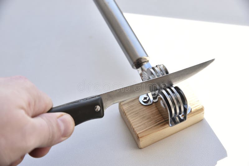 Sharpening an Iron Knife with a Sharpener Stock Image - Image of ...