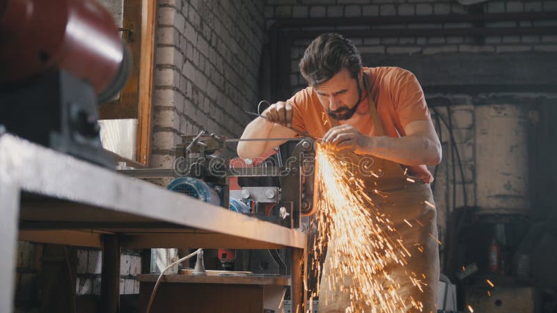 Sharpening Iron Tools with Sparkles - Forge Workshop Stock Photo ...