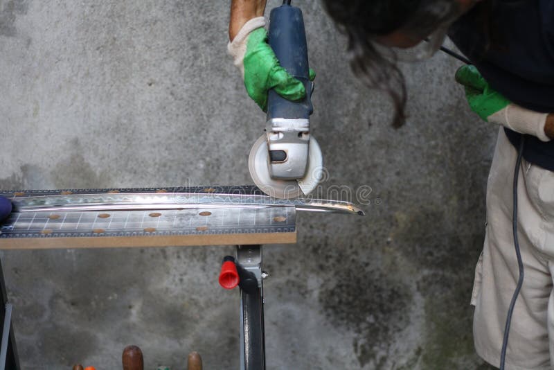 Sharpening a Katana sword stock image. Image of whet - 26568821
