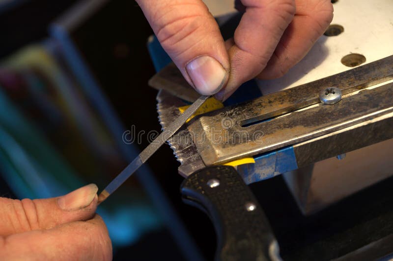 Sharpening of a Knife with a Gear Edge Stock Image - Image of sharp ...