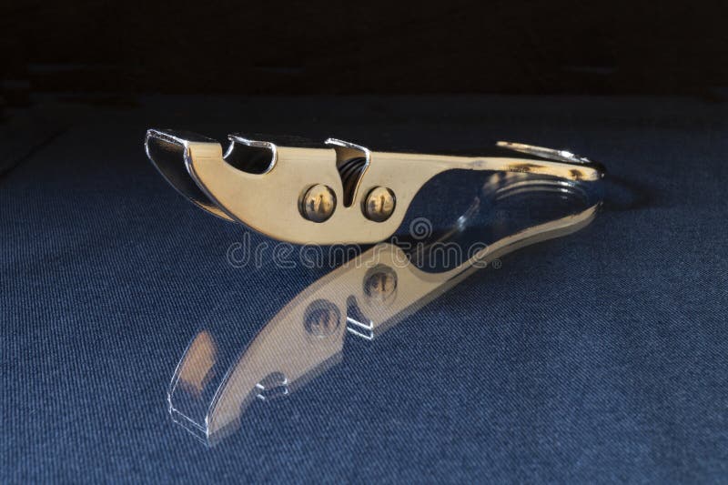 Sharpening the Knife from Steels Rests upon Turn Blue Table with ...