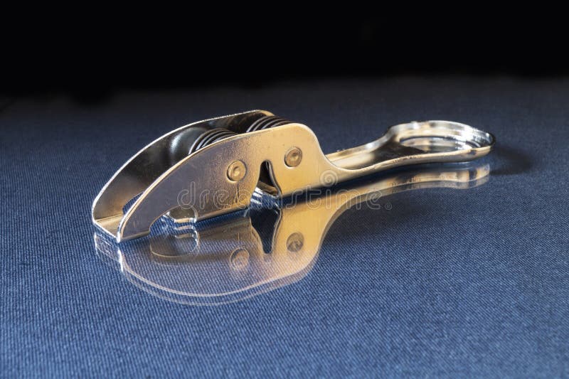 Sharpening the Knife from Steels Rests upon Turn Blue Table with ...