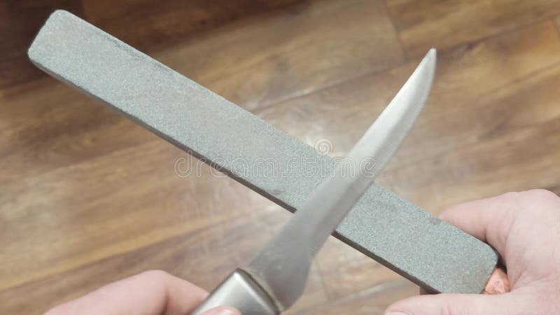 Sharpening Knife Using Abrasive Bar Stock Footage - Video of knife ...