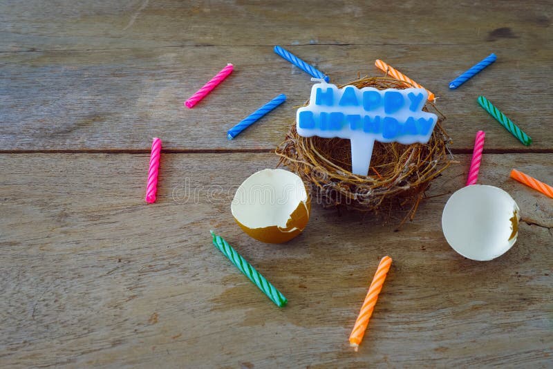 Shattered Eggshell with Nest and Candle for Happy Birthday Concept ...