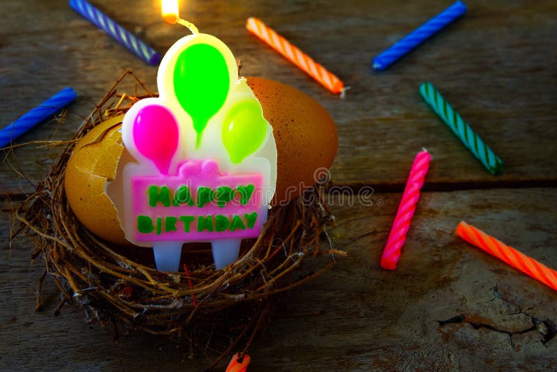 Shattered Eggshell with Nest and Candle for Happy Birthday Concept ...