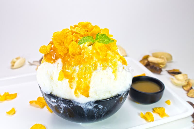 Shaved Ice with Milk, Conflex and Caramel. Yellow Dessert. Stock Photo ...