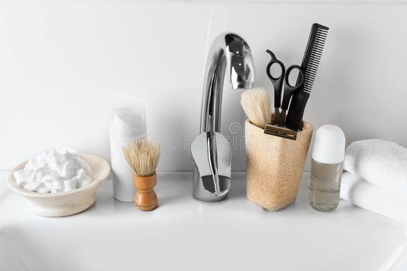 Shaving Accessories with Cosmetics for Men on Sink in Bathroom Stock ...