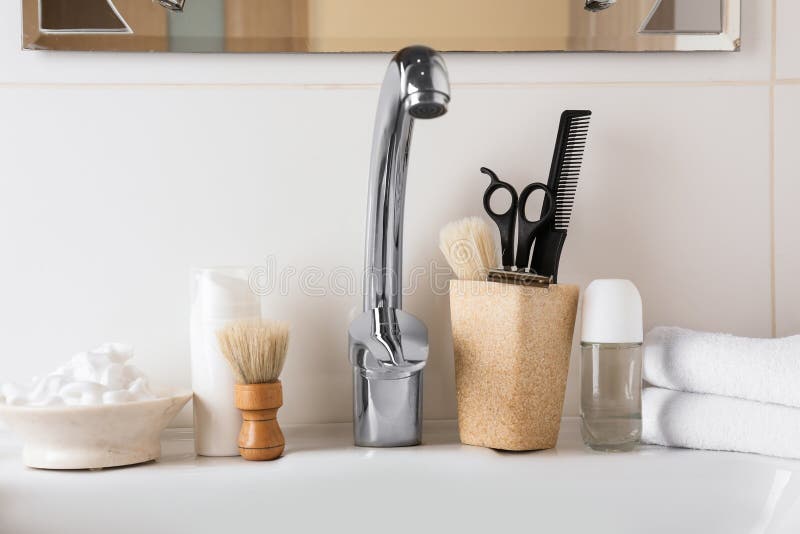 Shaving Accessories with Cosmetics for Men on Sink in Bathroom Stock ...