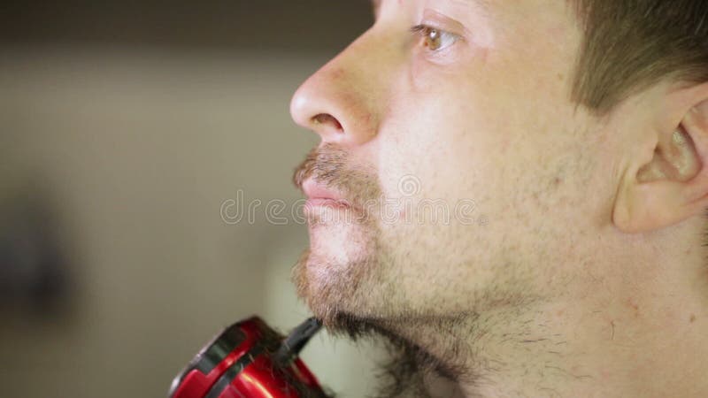 Shaving beard in profile stock footage. Video of caucasian - 40809680