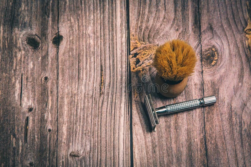 A Shaving Brush and Double Edged Razor on a Rustic Wooden Table Stock ...