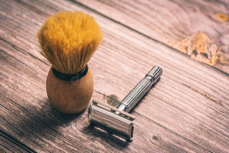 A Shaving Brush and Double Edged Razor on a Rustic Wooden Table Stock ...