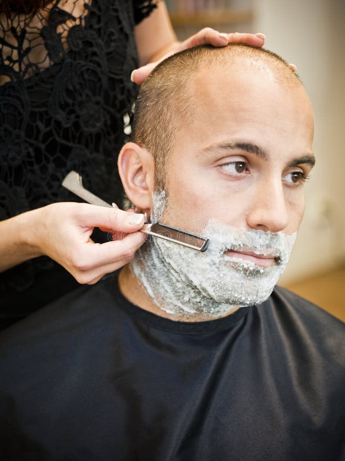 Shaving at the hair salon stock photo. Image of combing - 21922118