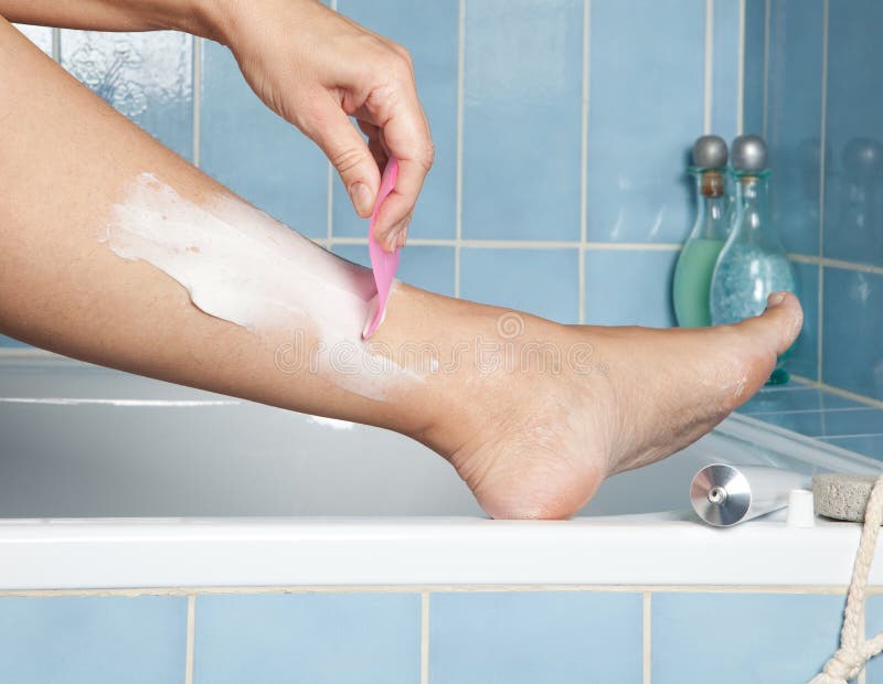 Shaving her legs stock photo. Image of hygiene, feet - 17157864