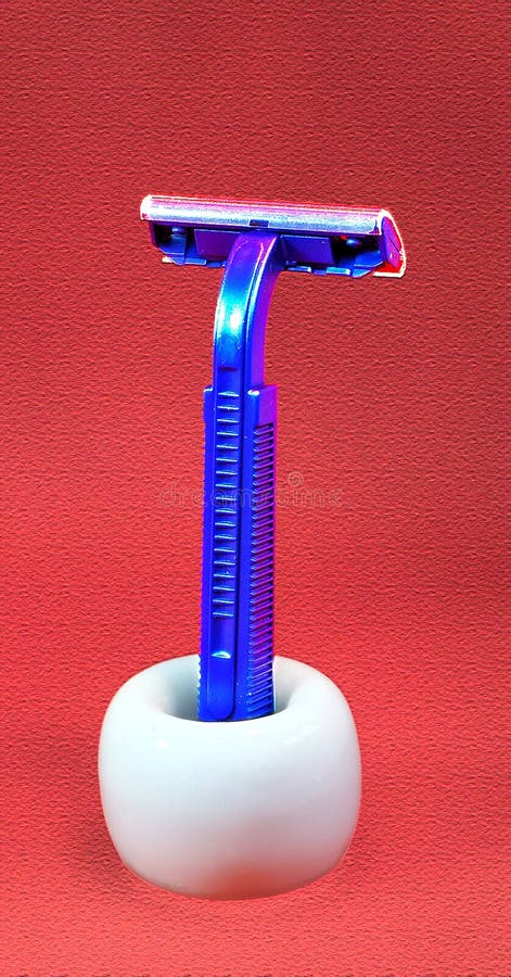 Shaving Machine Made of Blue Plastic, Standing in a White Porcelain ...