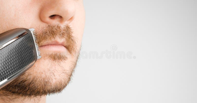 Shaving of Mustache with Electric Razor or Trimmer with Copy Space ...