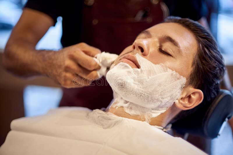 Shaving Process of Beards in Barbershop. Master Makes the Client Shave ...