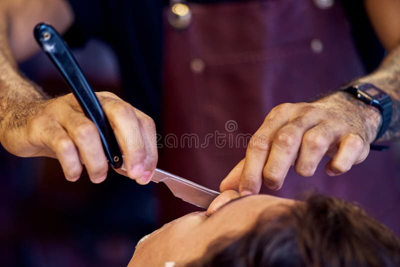 Shaving Process of Beards in Barbershop. Master Makes the Client Shave ...