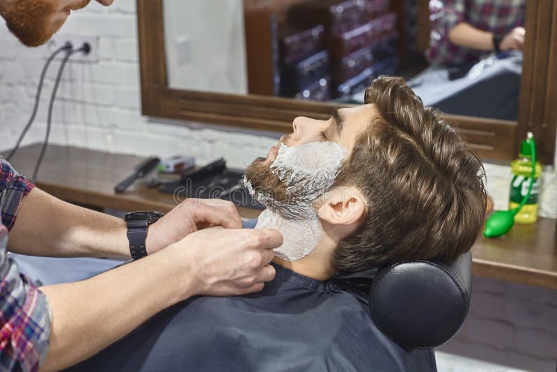 Shaving with a Straight Razor in the Barber Shop Stock Image - Image of ...