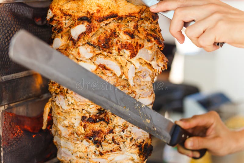 Shawarma meat being cut stock photo. Image of preparation - 77762600