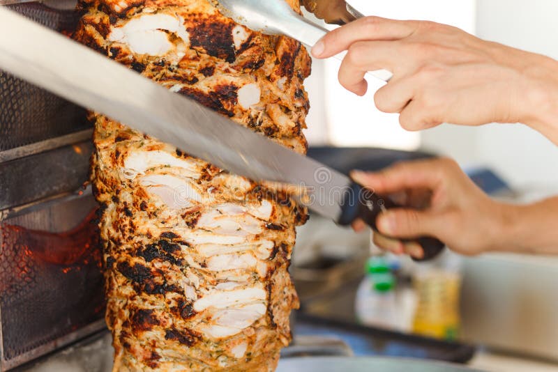 Shawarma meat being cut stock image. Image of cuisine - 126499905