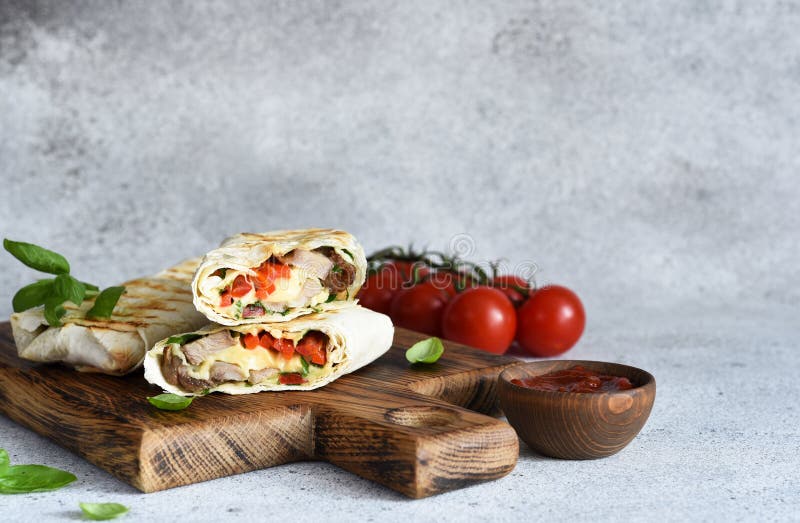 Shawarma with Meat and Vegetables on a Wooden Board on the Kitchen ...