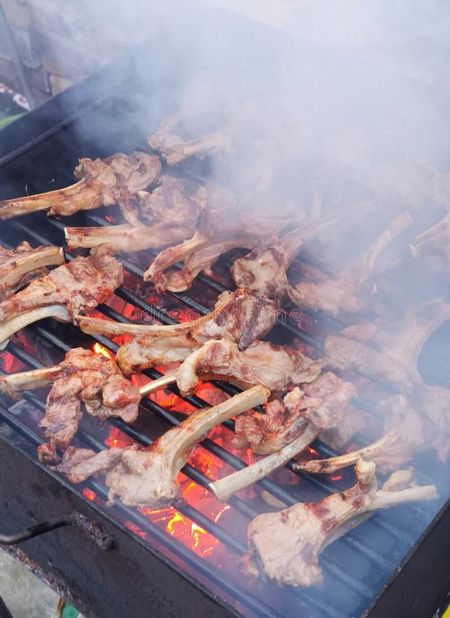 Sheep ribs on a hot grill stock photo. Image of barbecue - 184834264
