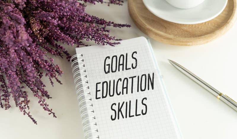 On a Sheet from the Diary Text GOALS EDUCATION SKILLS, Next To Glasses ...