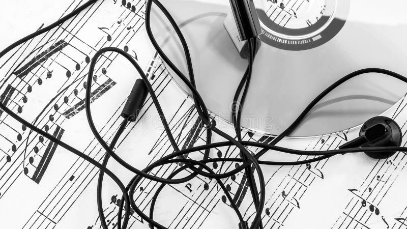 Sheet of Music with CD and Earphones Stock Image - Image of electronic ...