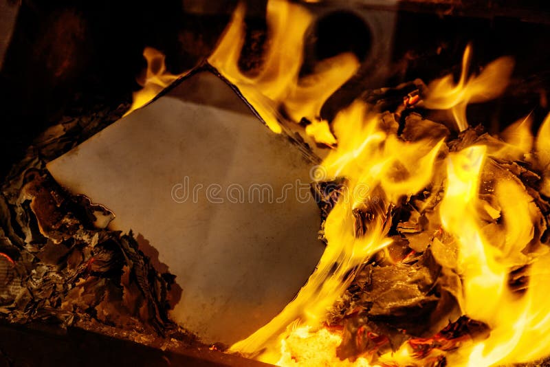 A sheet of paper on fire stock image. Image of burnt - 238480439