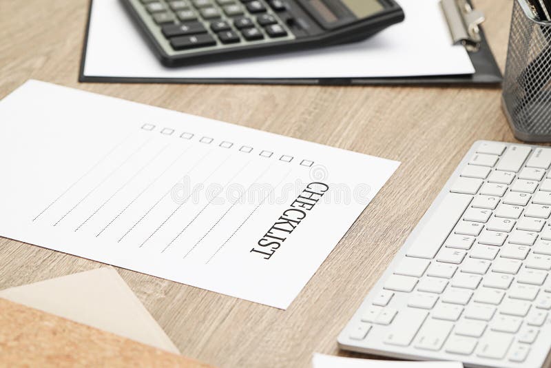 Sheet of Paper with Inscription Checklist on Wooden Table at Workplace ...