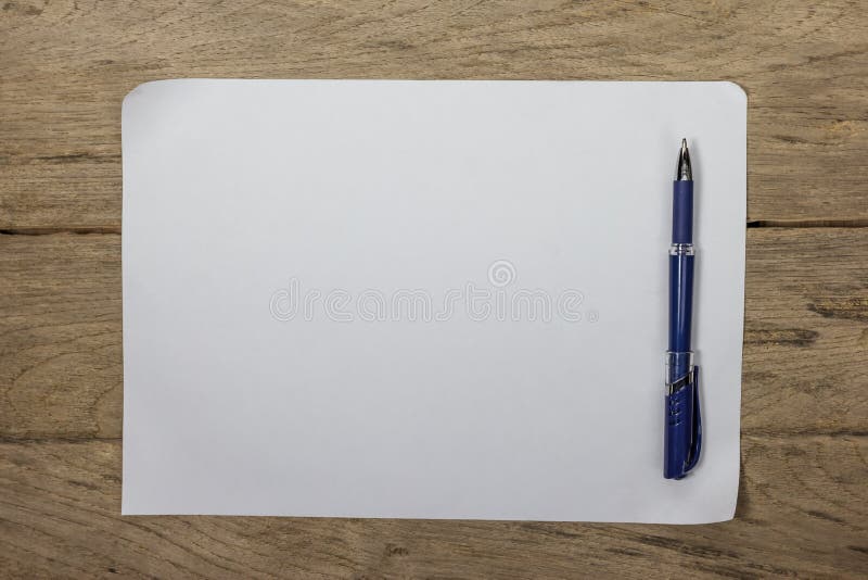A Sheet of Paper with a Pen on Wooden Office Desk Stock Photo - Image ...