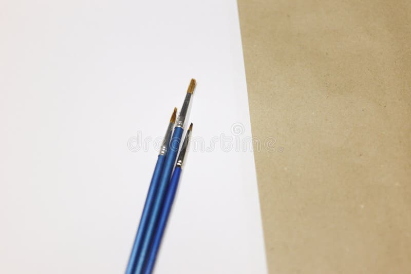 Sheet of White Paper and Artistic Brushes on a Crafting Background ...