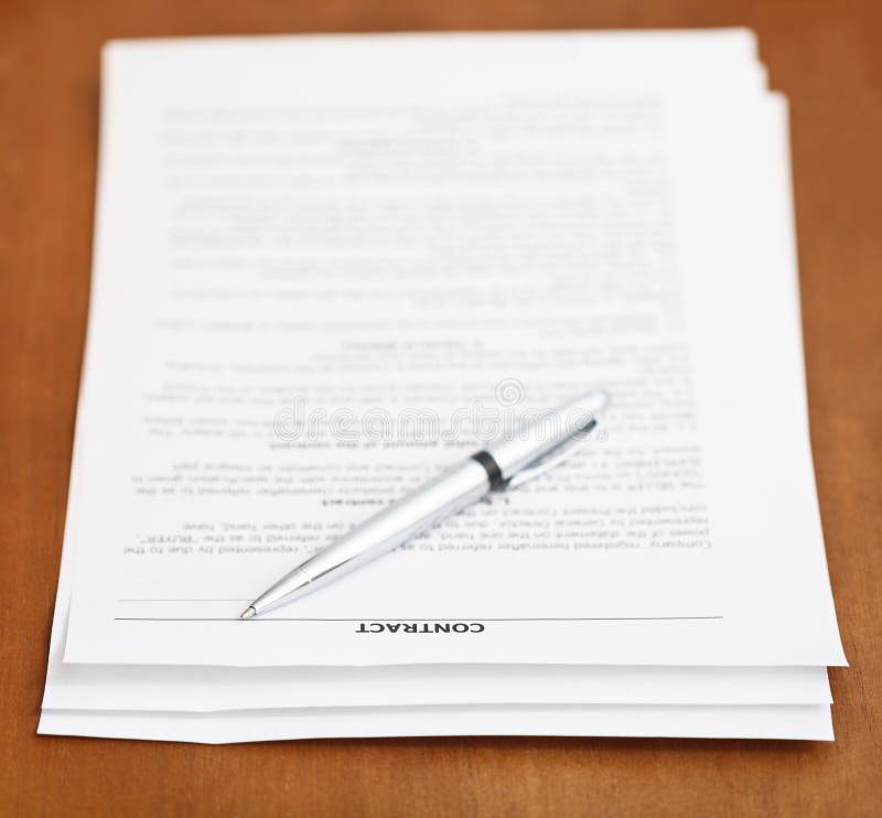 Sheets of Contract and Silver Pen on Wooden Table Stock Image - Image ...
