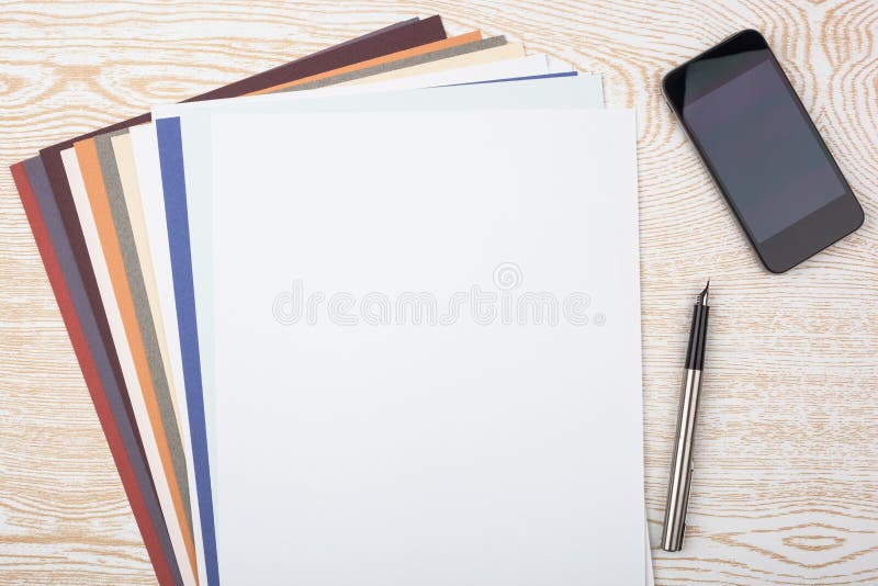 Sheets of Multicolored Paper on Wooden Texture Stock Photo - Image of ...