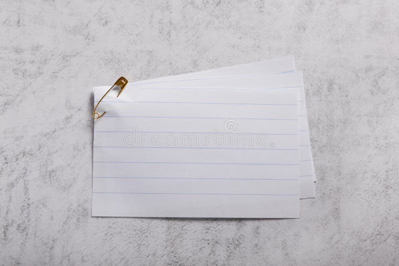 Sheets of Paper Attached with Safety Pin on Grey Textured Background ...