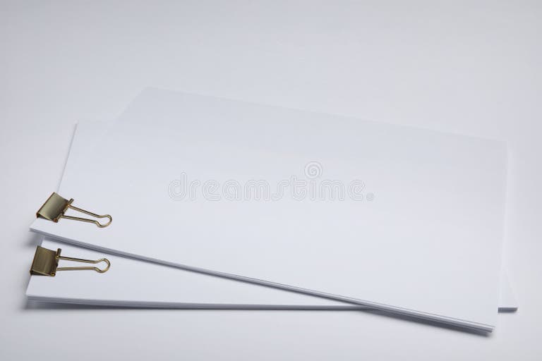 Sheets of Paper with Clips on White Background Stock Image - Image of ...