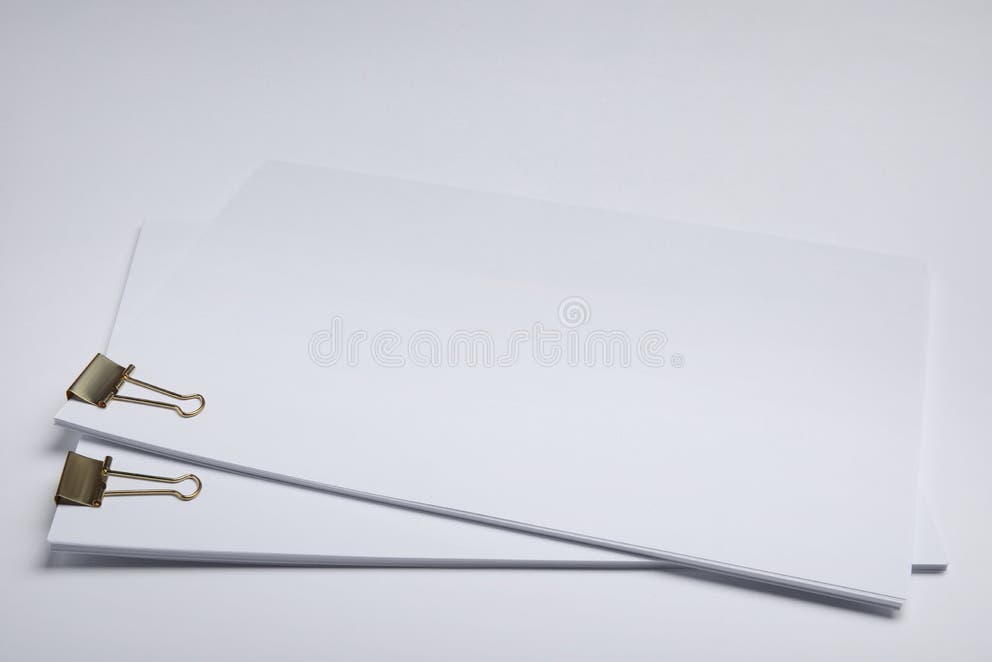 Sheets of Paper with Clips on White Background Stock Image - Image of ...