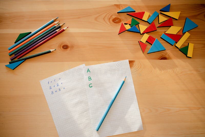 Sheets Of Paper With Math And Writing Tasks On A Wooden Table Stock ...