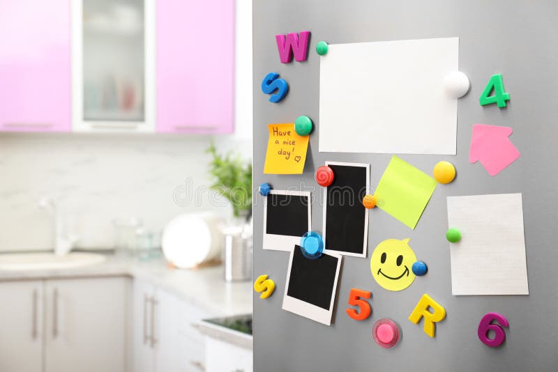 Sheets of Paper and Photos with Colorful Magnets on Refrigerator Door ...