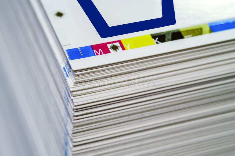 Sheets of Printed Products. Offset Printing. CMYK Press. Paper at the ...