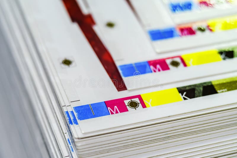 Sheets of Printed Products. Offset Printing. CMYK Press. Paper at the ...